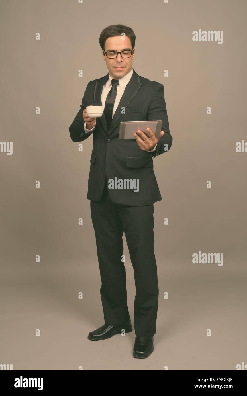 Portrait of handsome Persian businessman in suit Stock Photo - Alamy