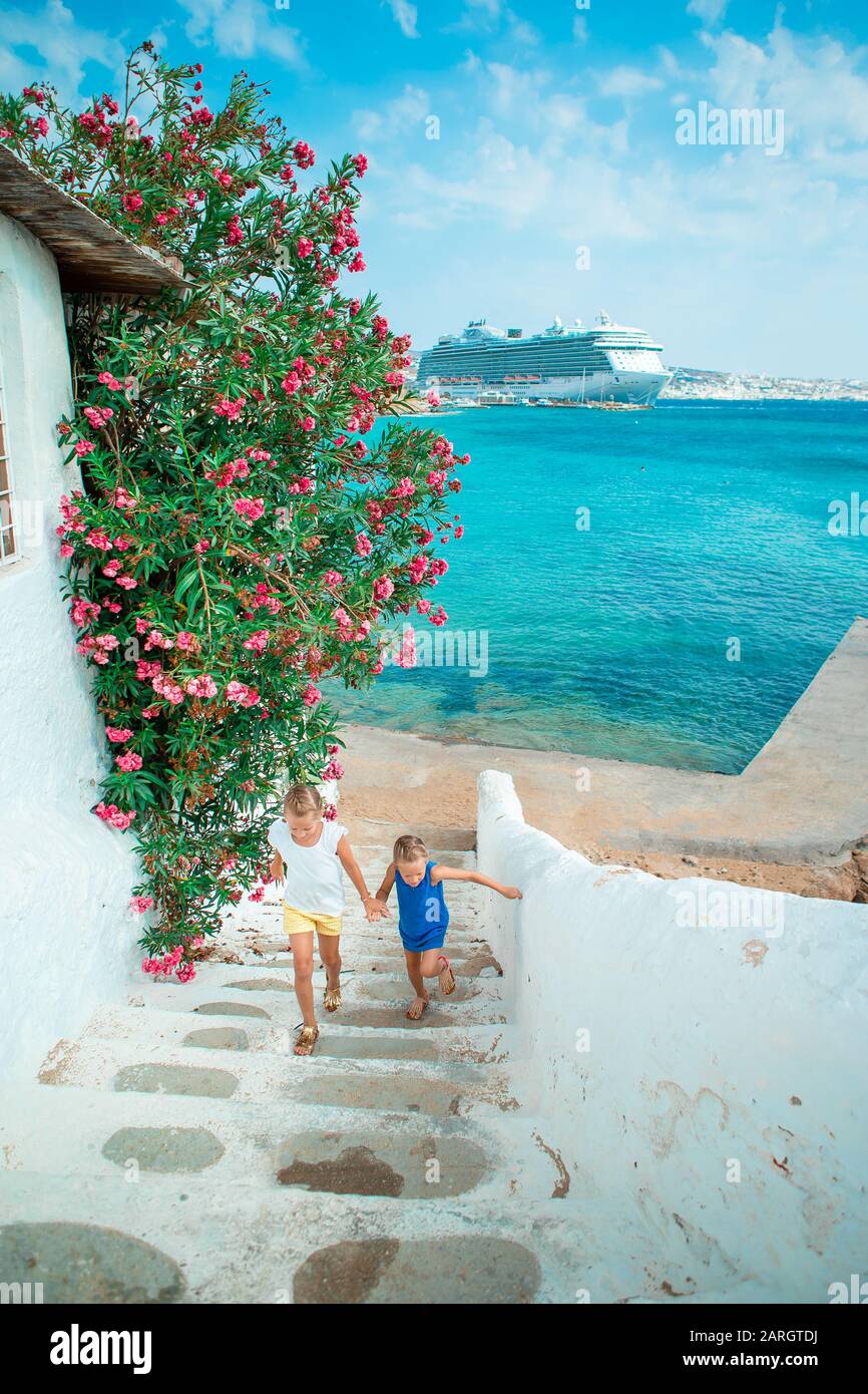 Little happy girls on Mykonos Island, in Greece Stock Photo - Alamy