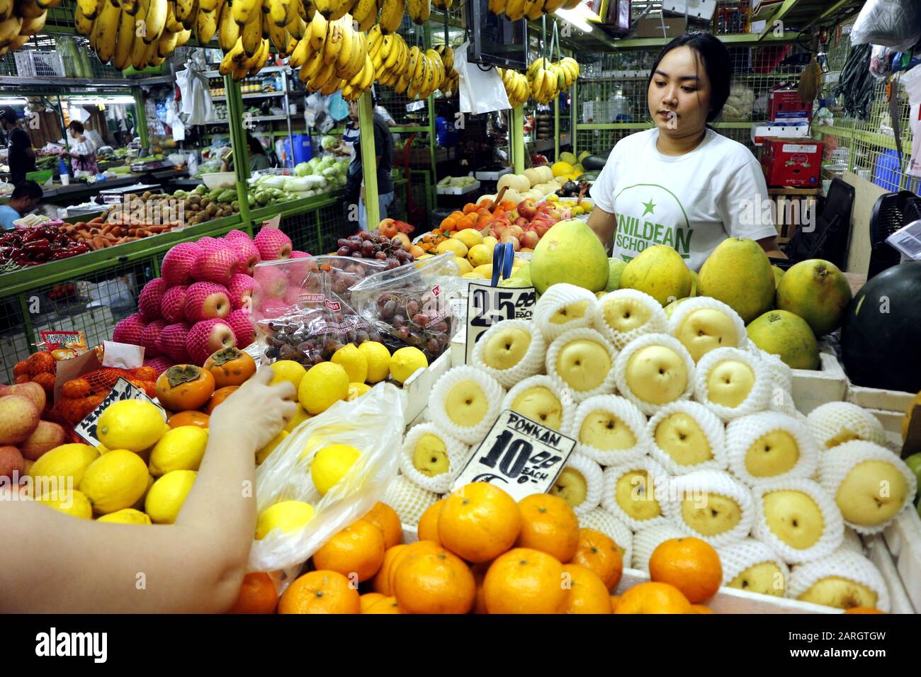 Antipolo City, Philippines - January 27, 2020: Market stall owner sells ...