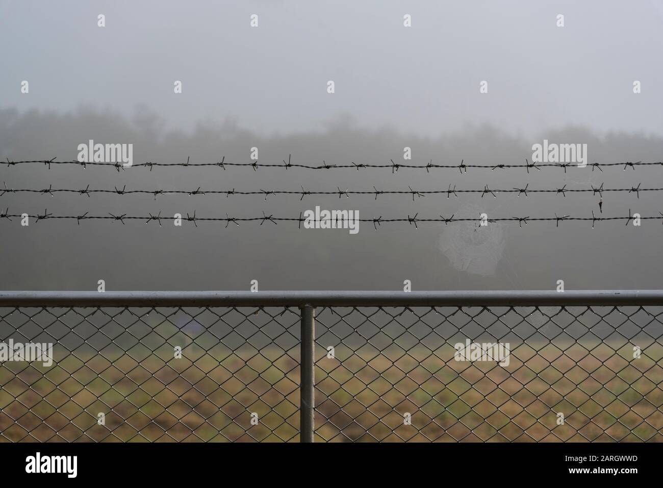 Barbed wire with metal crossed hence around private area no entrance ...