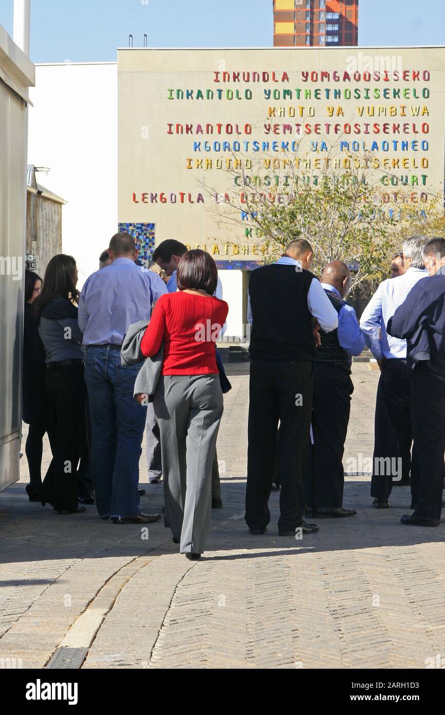 Lawyers, businesspeople and sign outside the Constitutional Court ...