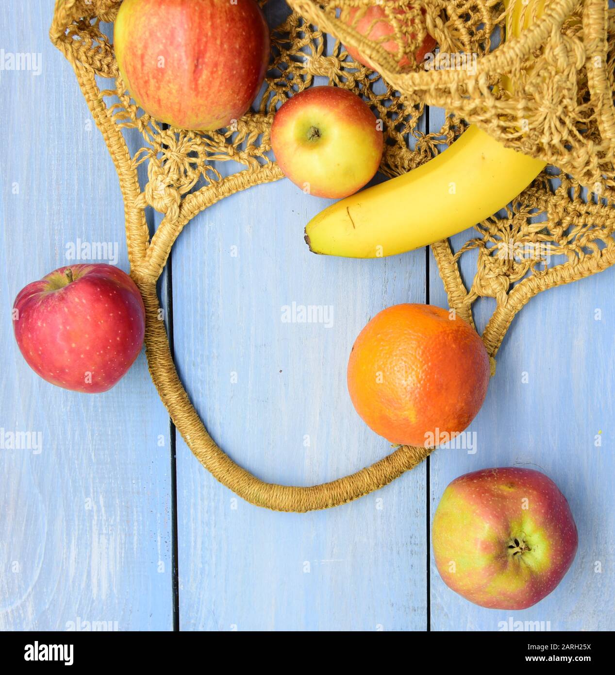 Various fresh fruits in a woven bag made of environmentally friendly ...