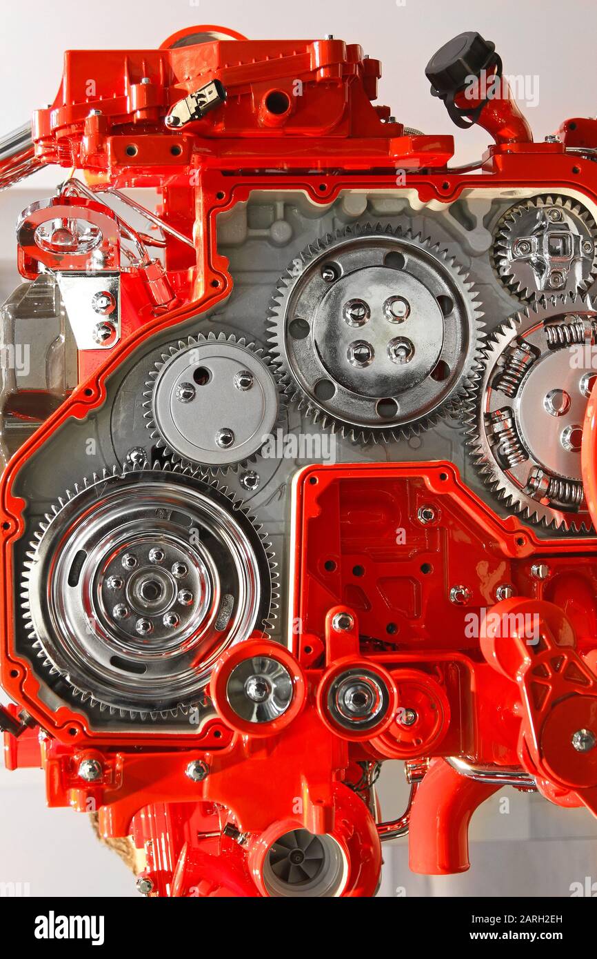 Silver gears in red transmission box machine Stock Photo - Alamy