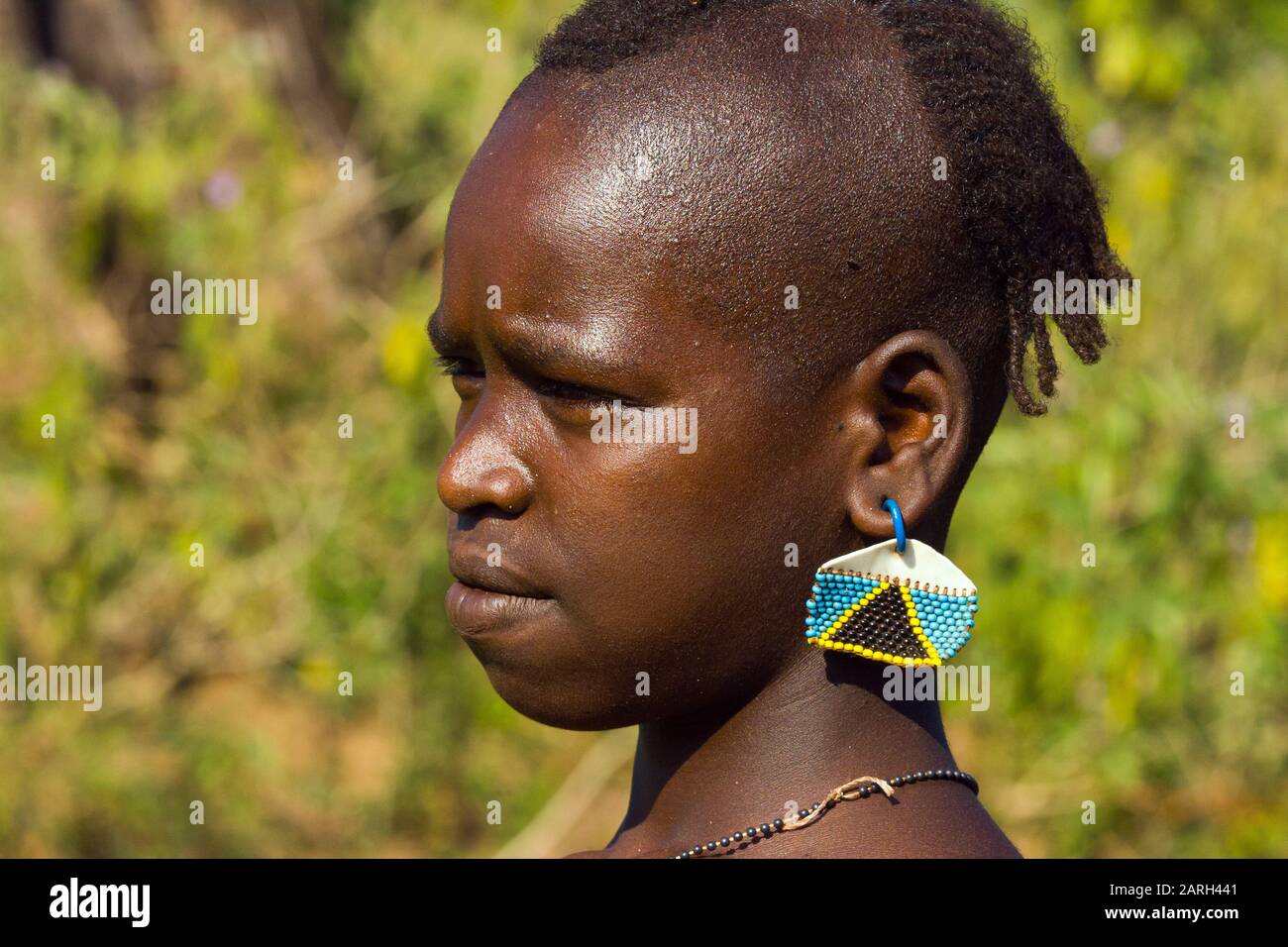 Young Hamer girl with traditional clothings and hairstyle, Hamer tribe ...