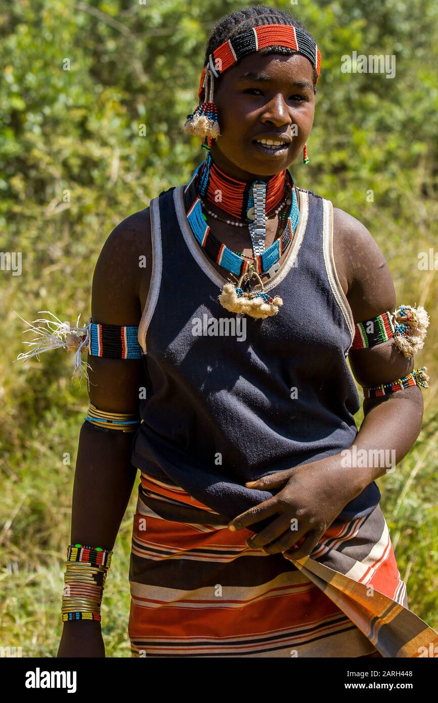Young Hamer woman with traditional clothings and hairstyle, Hamer tribe ...