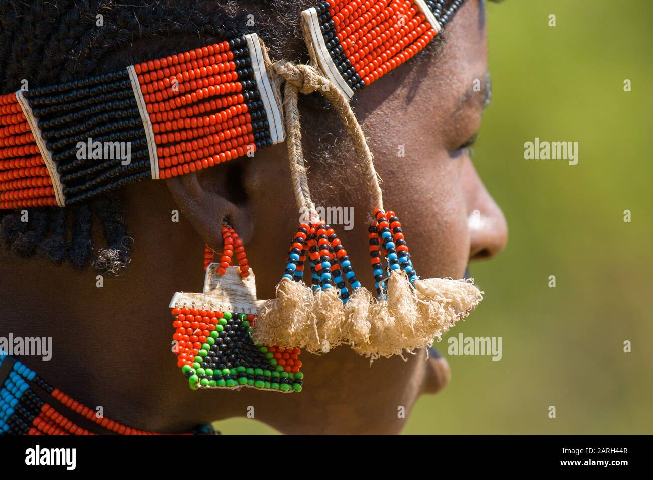 Young Hamer woman with traditional clothings and hairstyle, Hamer tribe ...