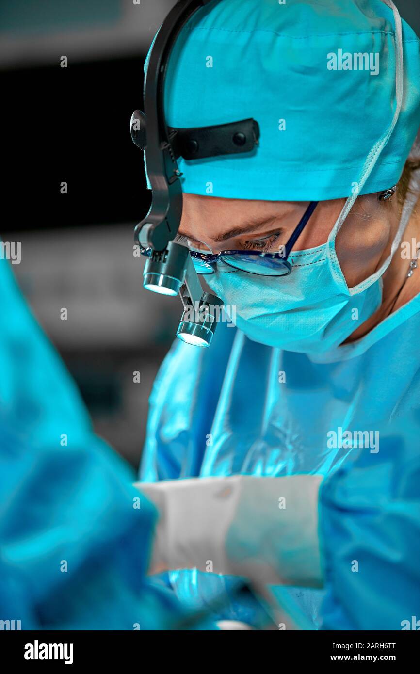 Surgeons team in the operating room, portraits close-up. modern ...