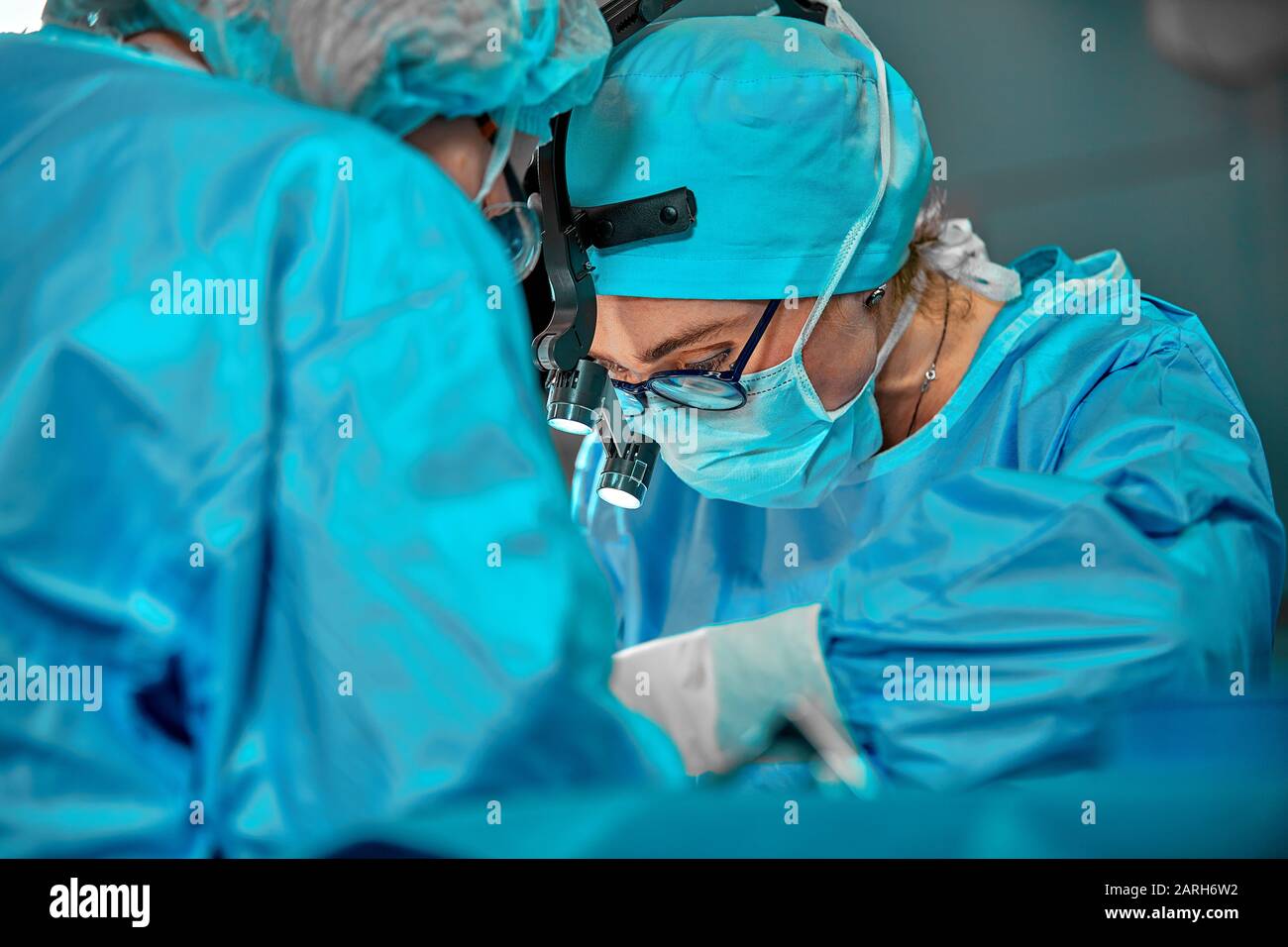 Surgeons team in the operating room, portraits close-up. modern ...