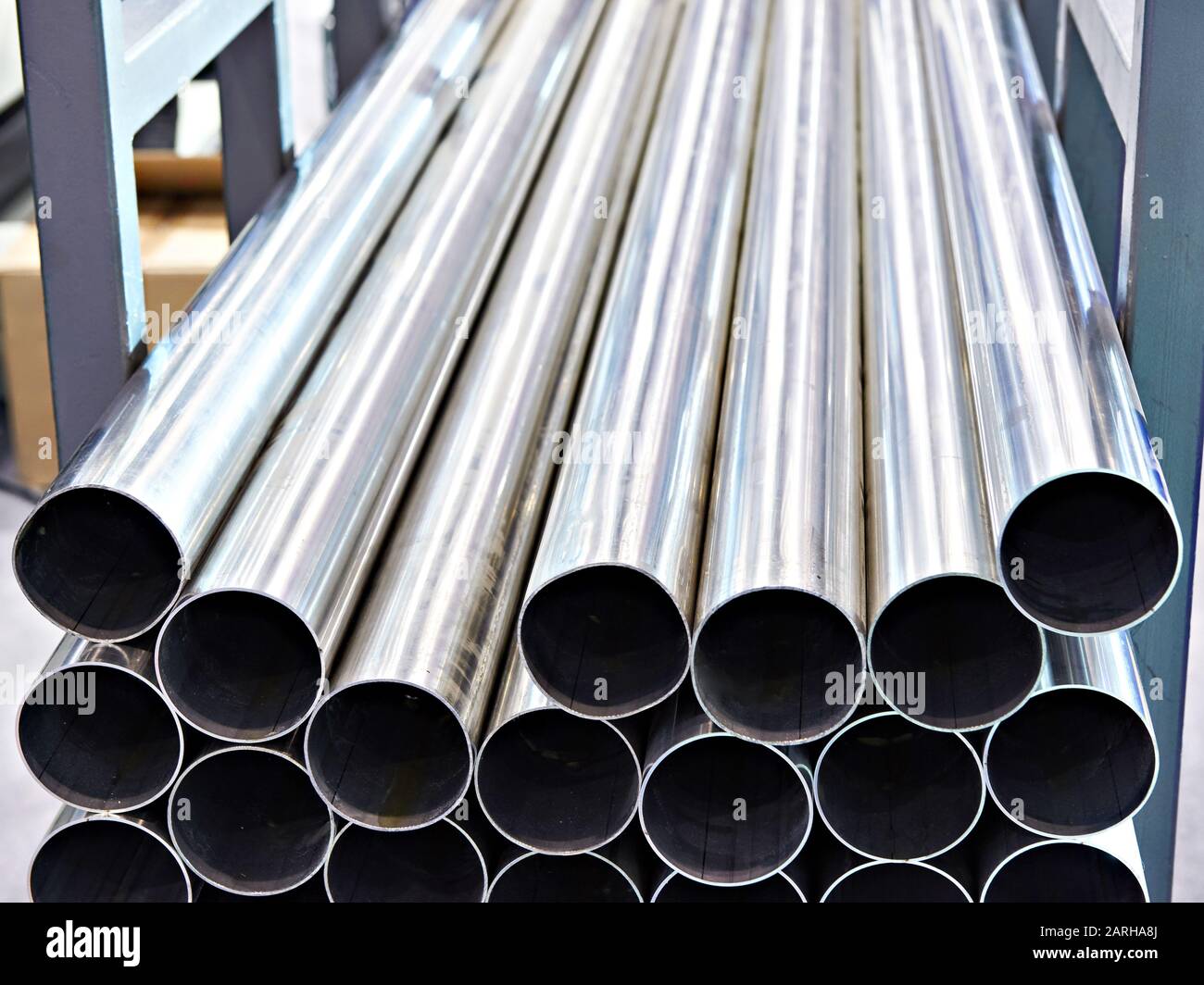 Steel pipes in stack closeup Stock Photo - Alamy