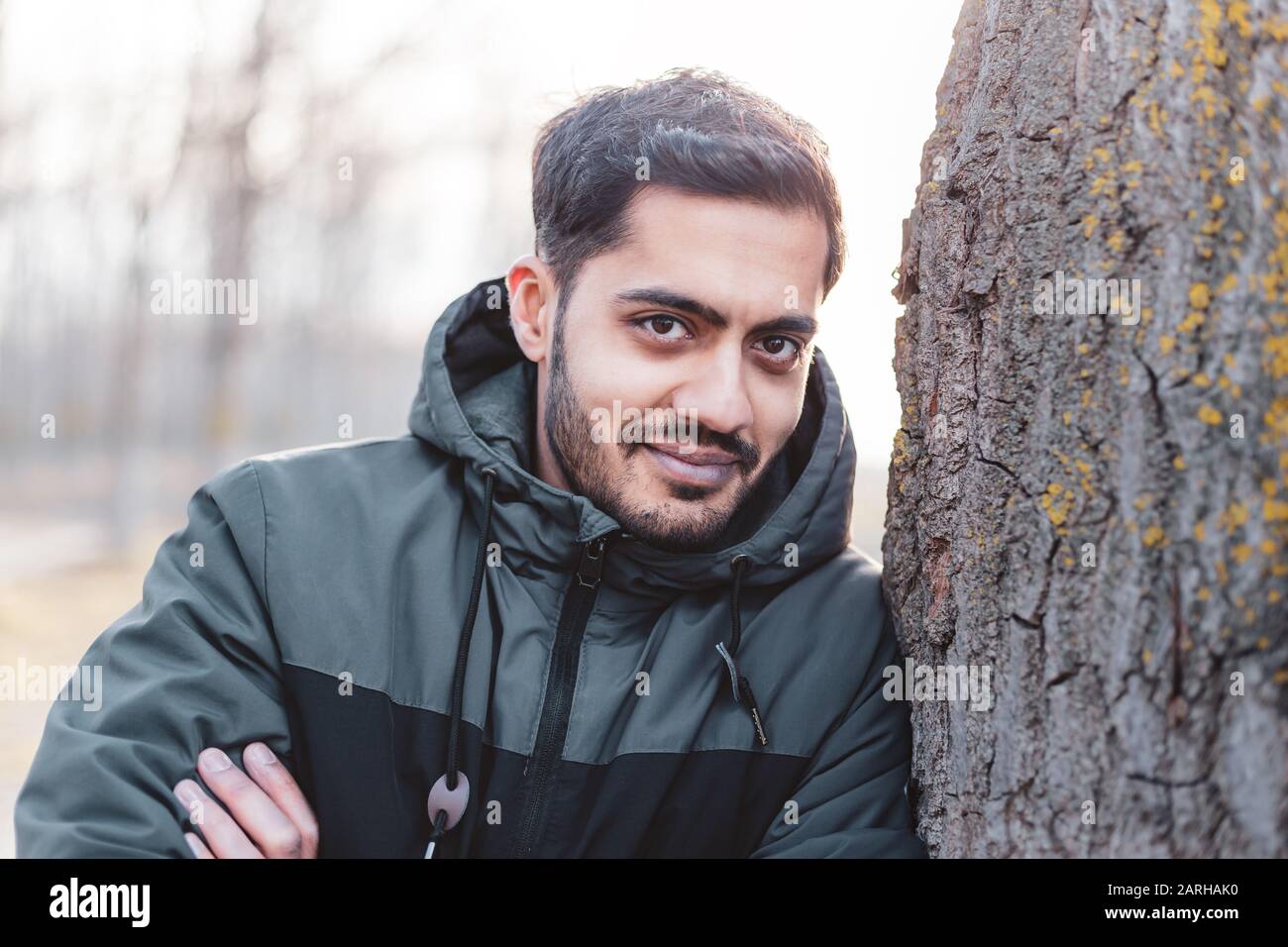 Male model sitting in tree hi-res stock photography and images - Alamy