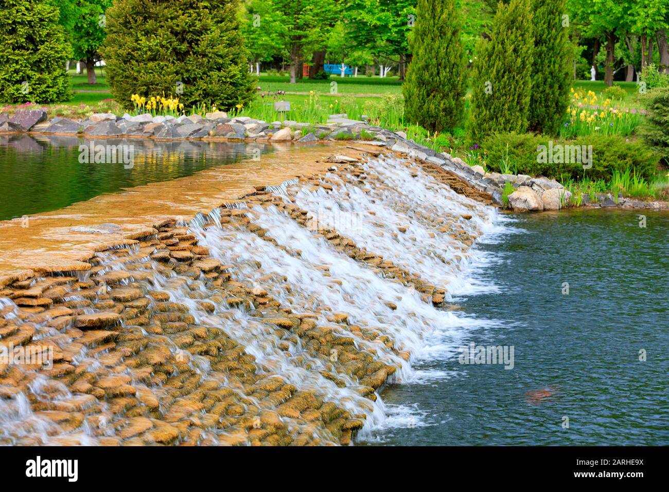 A beautiful decorative waterfall refreshes the space in hot weather in ...