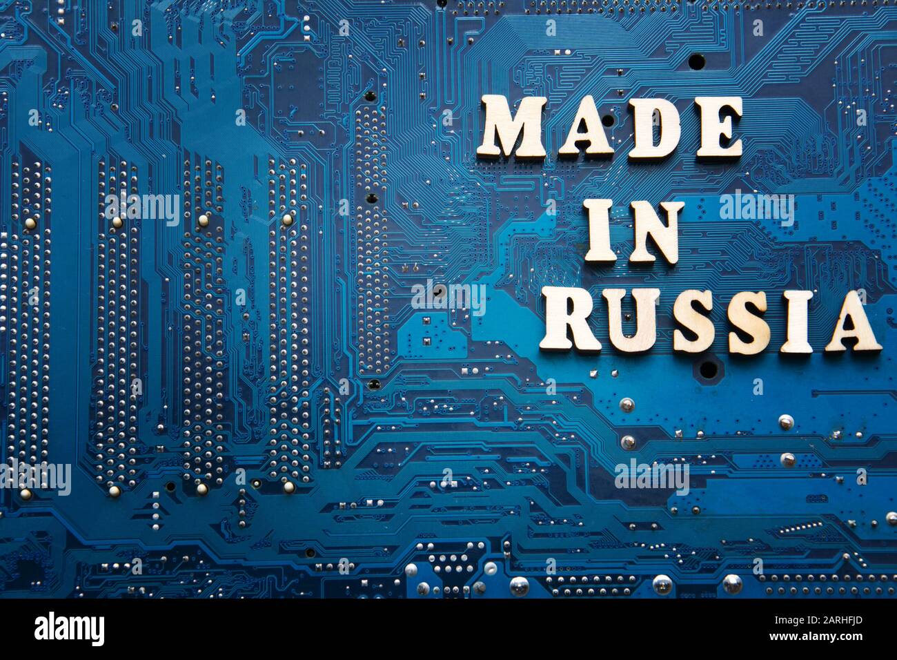 Made in Russia. Inscription on a blue printed circuit board background ...
