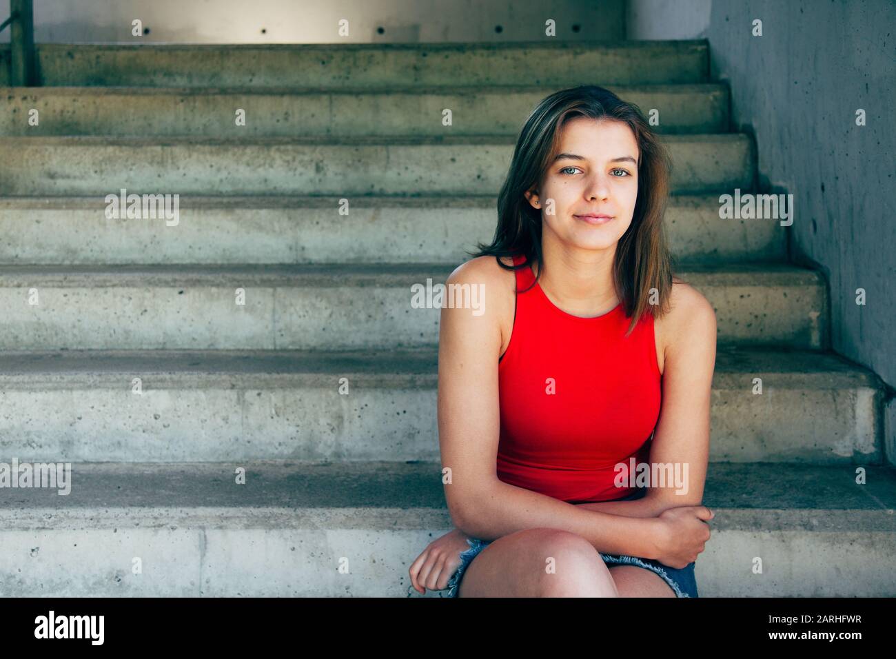 Woman sitting on stairs skirt hi-res stock photography and images - Alamy