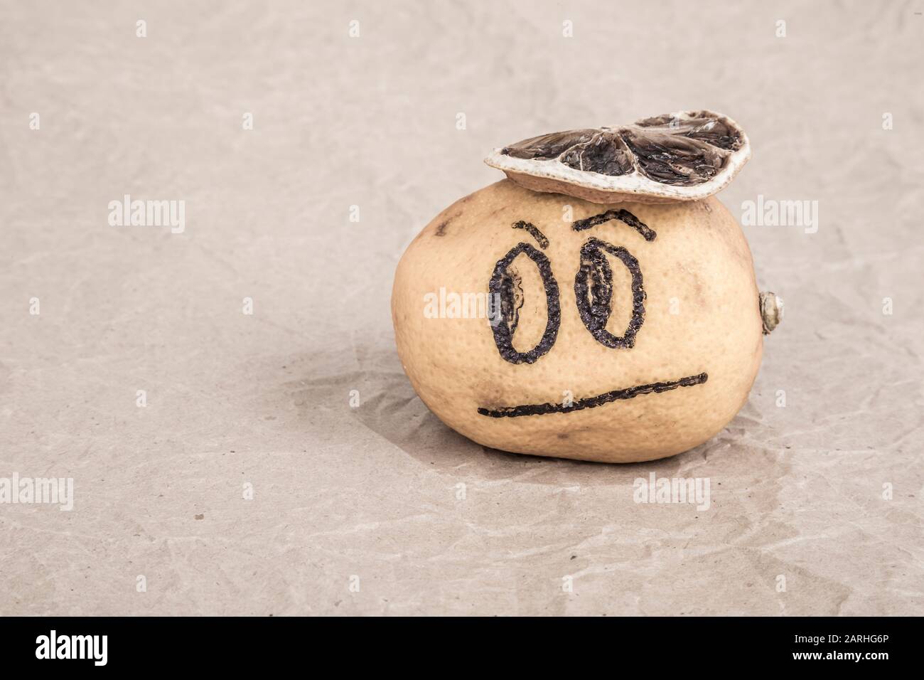 A lemon with sad expression Stock Photo - Alamy