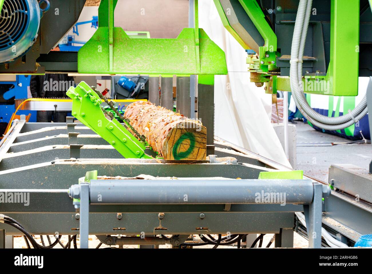 Special operator-operated hooks automatically turn the log on a modern ...