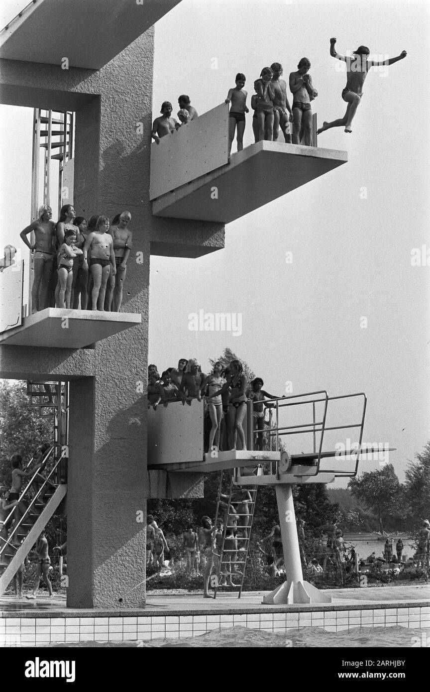 Heat wave continues Swimmers dive from a high springboard Date: August ...