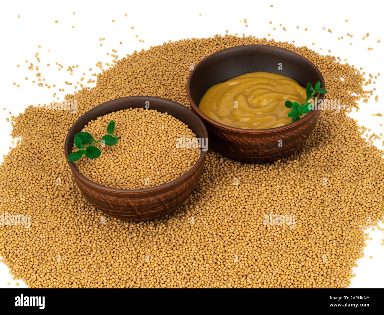 Mustard in a plate and mustard seeds Stock Photo - Alamy