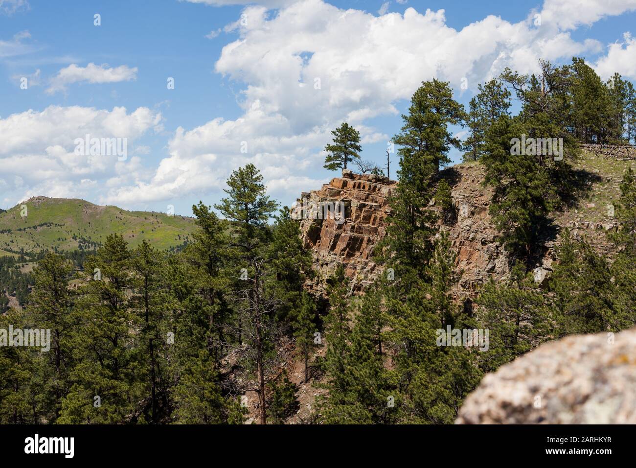 A landscape view of the Black Hills of South Dakota with green hills ...