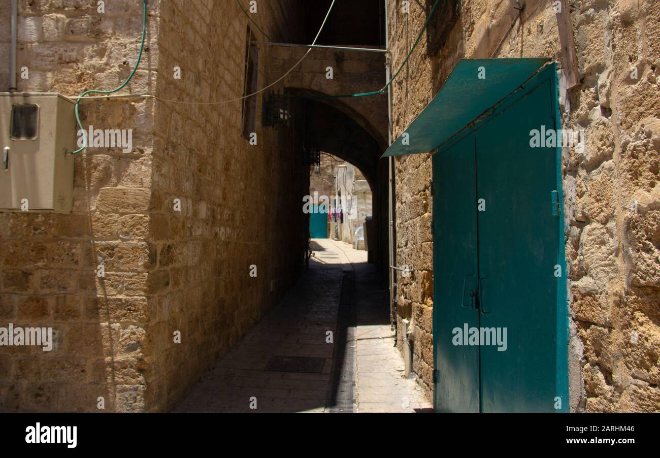 Arches over a narrow ancient street Stock Photo - Alamy