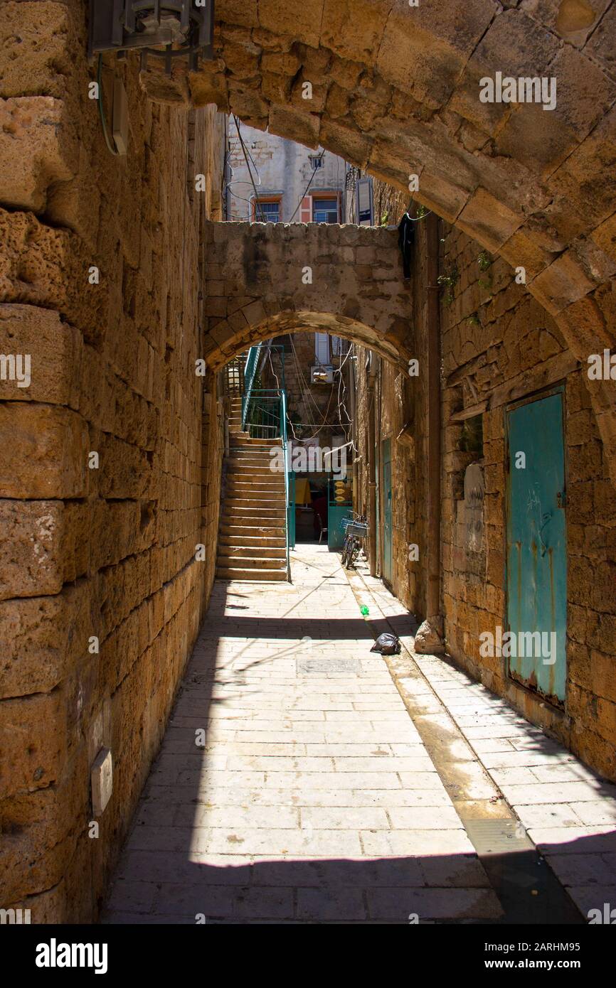 Arches over a narrow ancient street Stock Photo - Alamy
