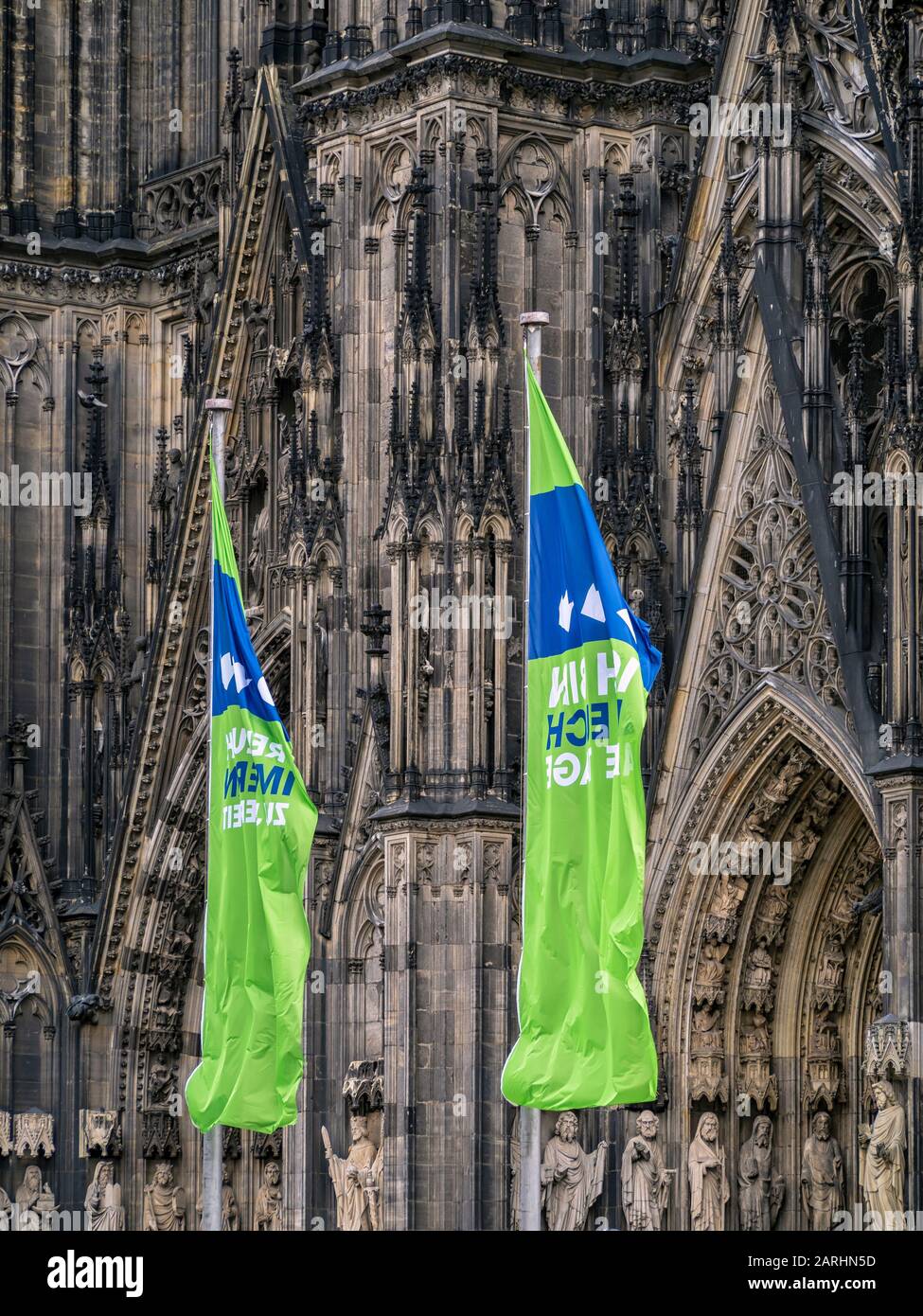COLOGNE, GERMANY - JULY 05, 2019: Banner flags outside the gothic ...