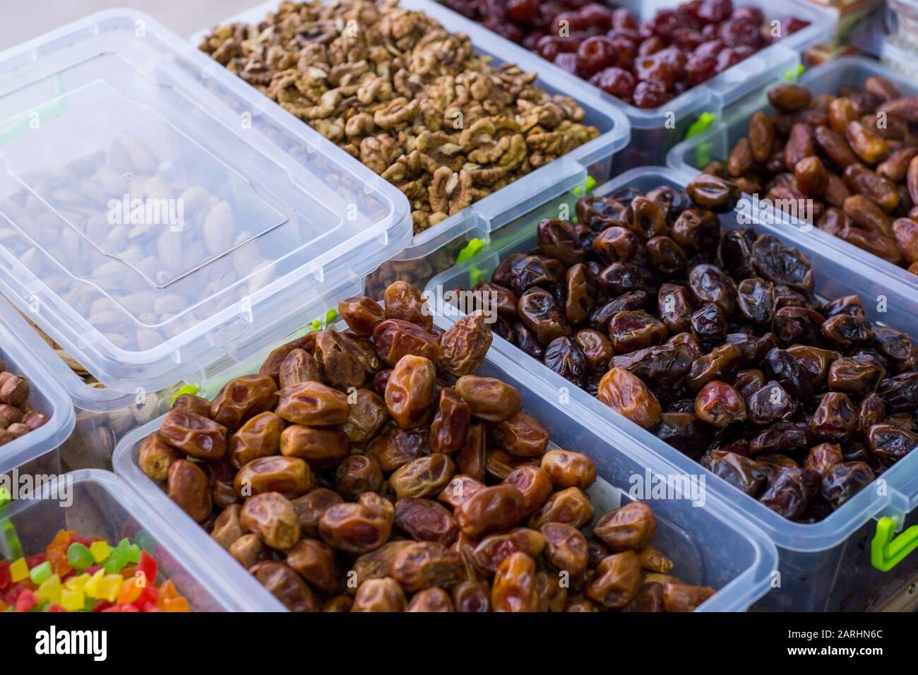 Dried dates Fruit store counter with dried fruits. In plastic ...