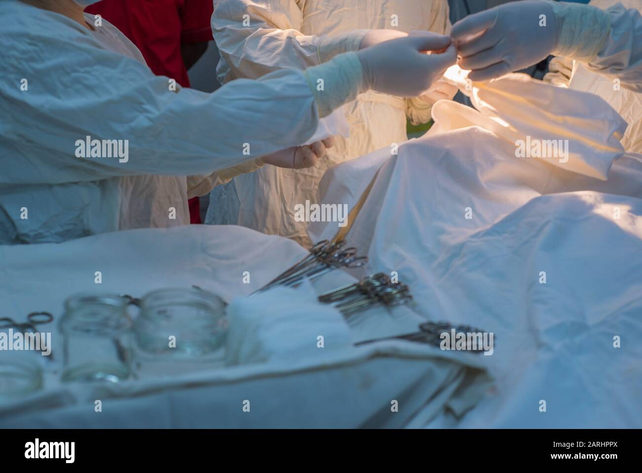 Medical team performing operation. Group of surgeon at work in ...