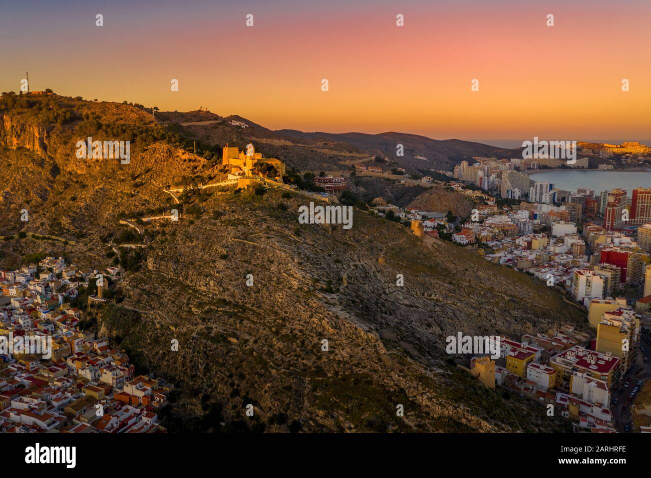 Aerial sunset panorama view of Cullera castle and popular seaside ...