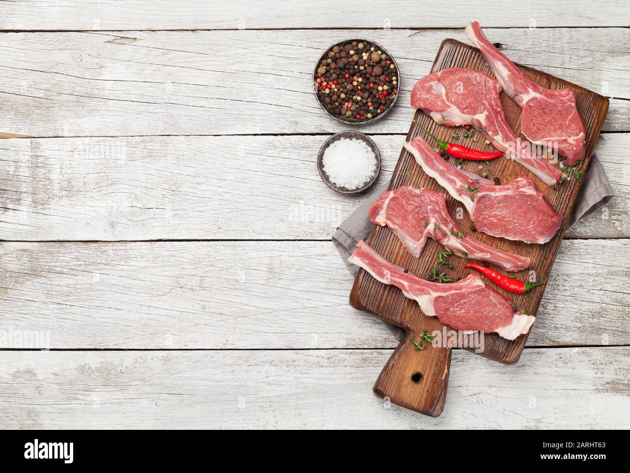 Lamb ribs cooking. Raw rack of lamb with spices and condiments. Top ...