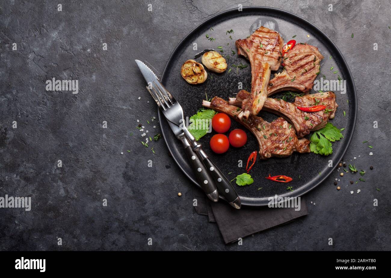 Grilled lamb ribs. Hot rack of lamb with spices and condiments. Top ...