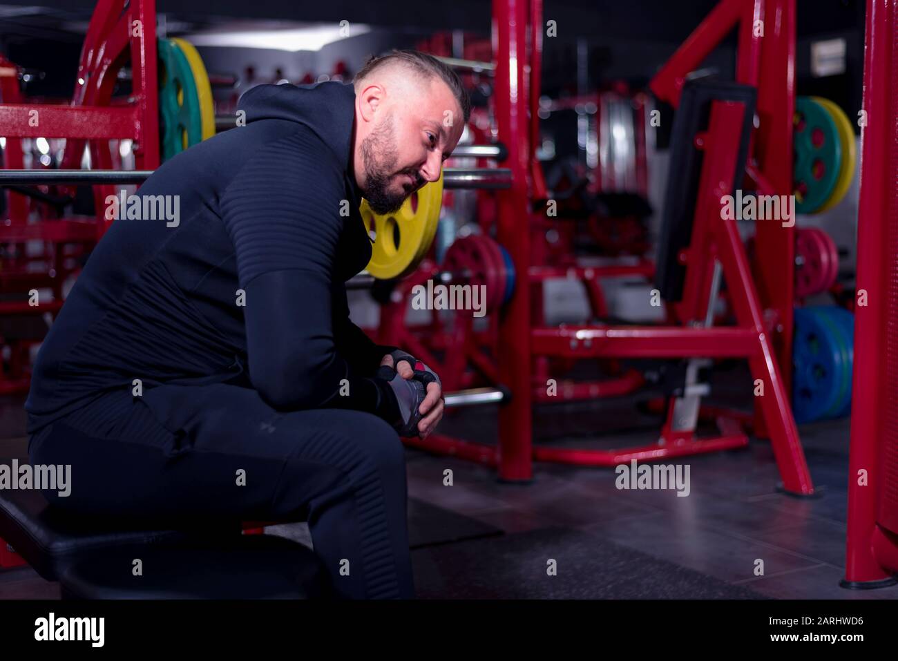 Bodybuilder resting after workout. Muscular Man Resting After Exercise ...