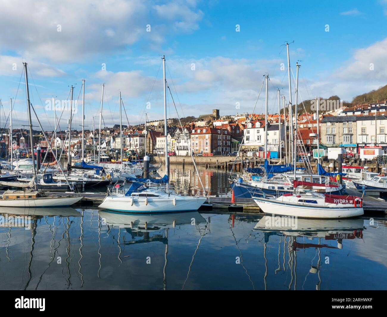 Yachts moored in the outer harbour at Scarborough Harbour with Sandside ...