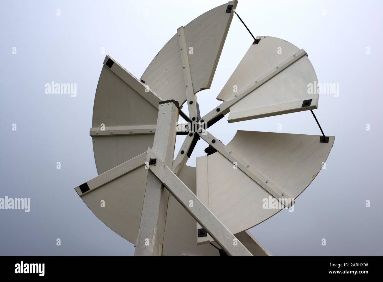 white windmill against grey sky Stock Photo - Alamy