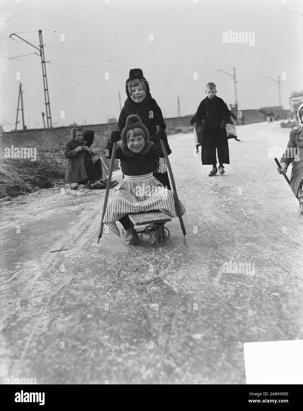 Skating in Volendam. Children on the ice with a puncture sleigh Date ...