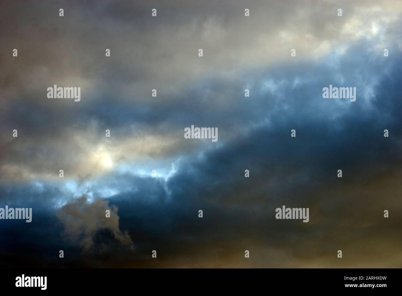 Beautiful evening storm clouds breaking up to show a clear blue sky ...
