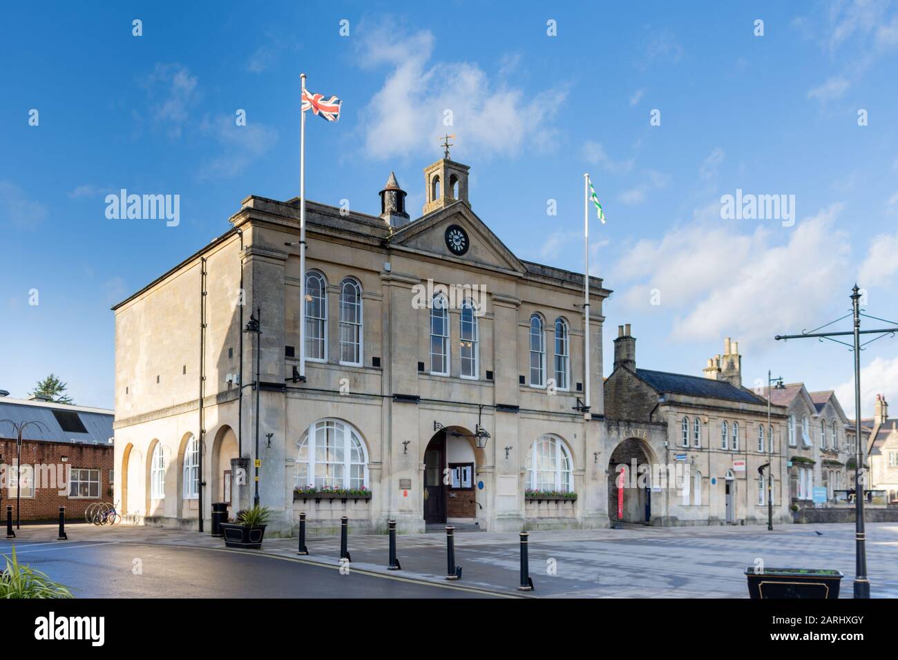 Melksham Town Hall against a blue winter sky with flags flying on a ...