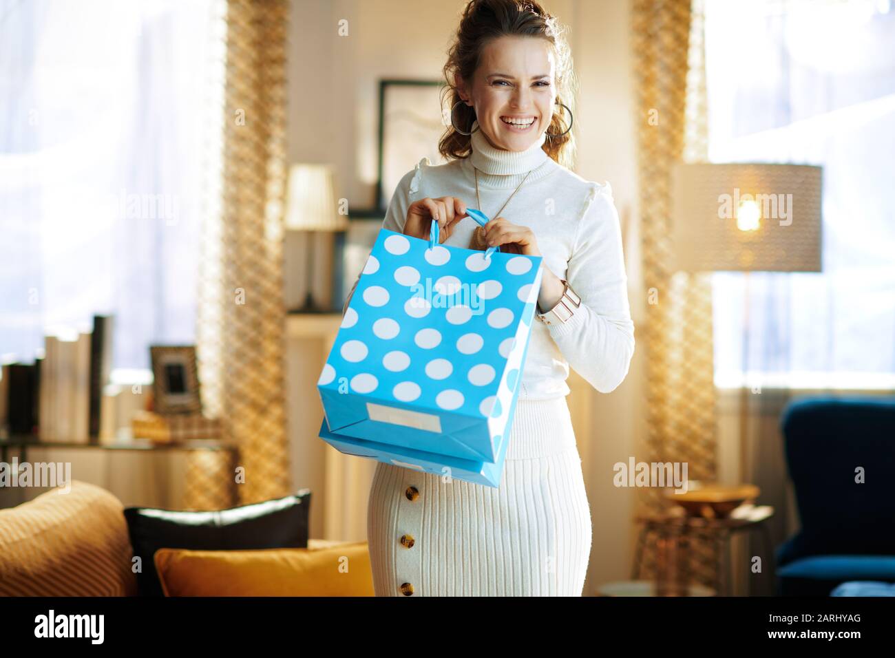 Happy woman wearing blue turtleneck hi-res stock photography and images ...