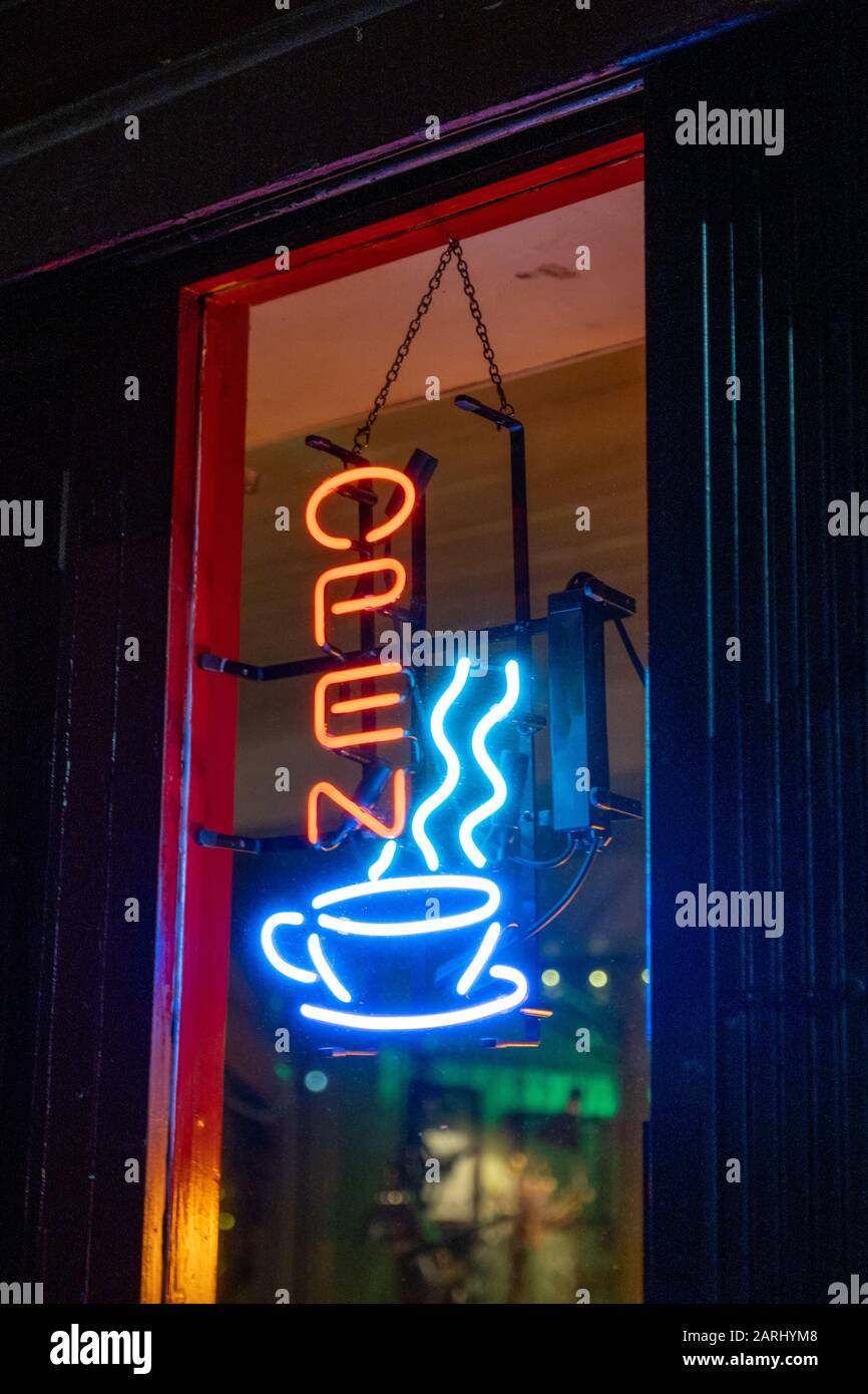 "Open" neon sign in a cafe window Stock Photo - Alamy