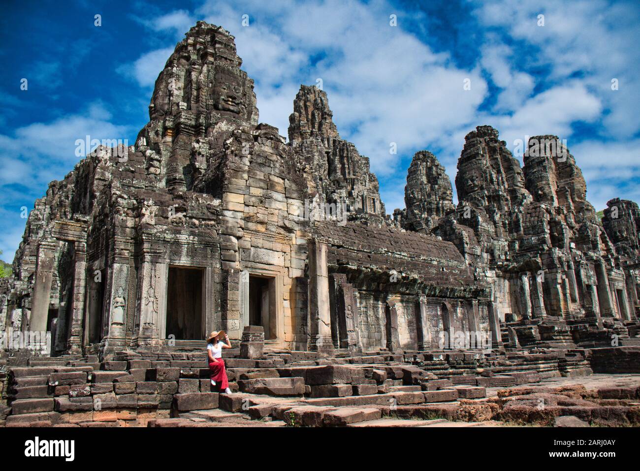 Beautiful, pretty, young Thai girl is exploring the ancient ruins of ...