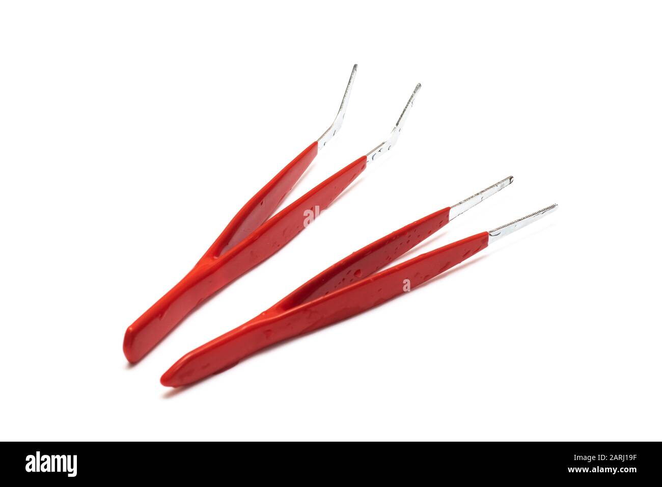 Two red forceps close up, isolate on a white background Stock Photo - Alamy