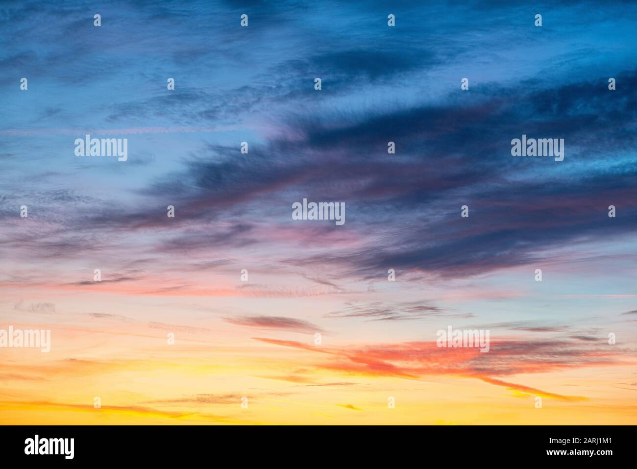 Evening sunset sky with bright rays of the sun and beautiful colorful ...