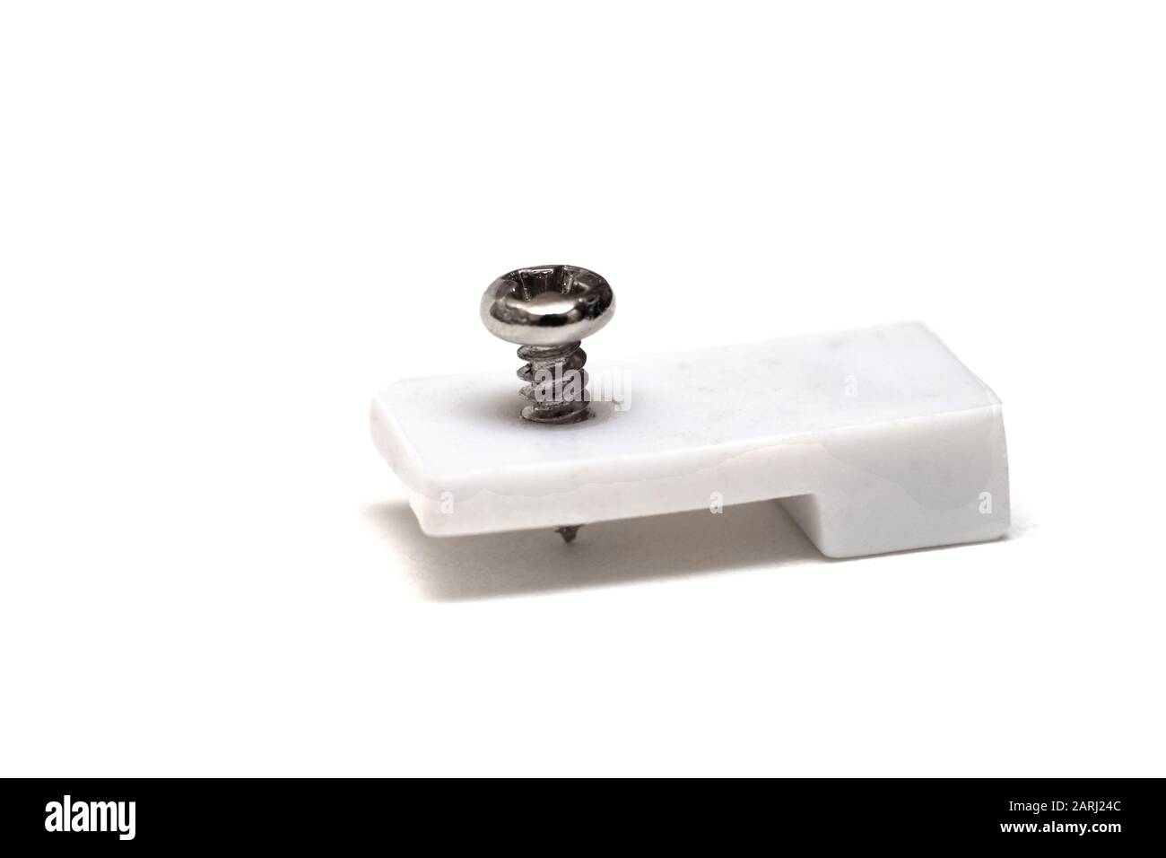 Screw twisted in white device close up with copy space Stock Photo - Alamy