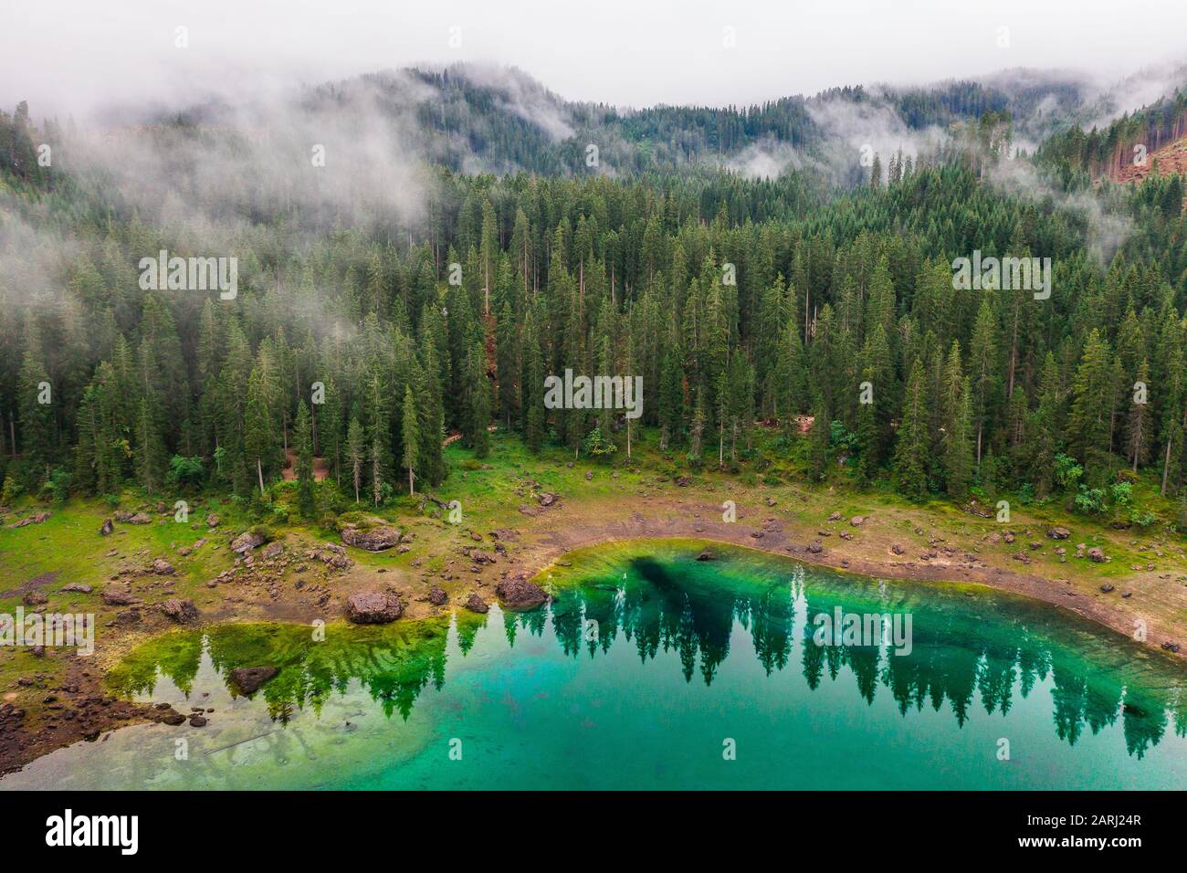 Aerial view of turquoise blue water of lake Carezza in Alps Dolomites ...