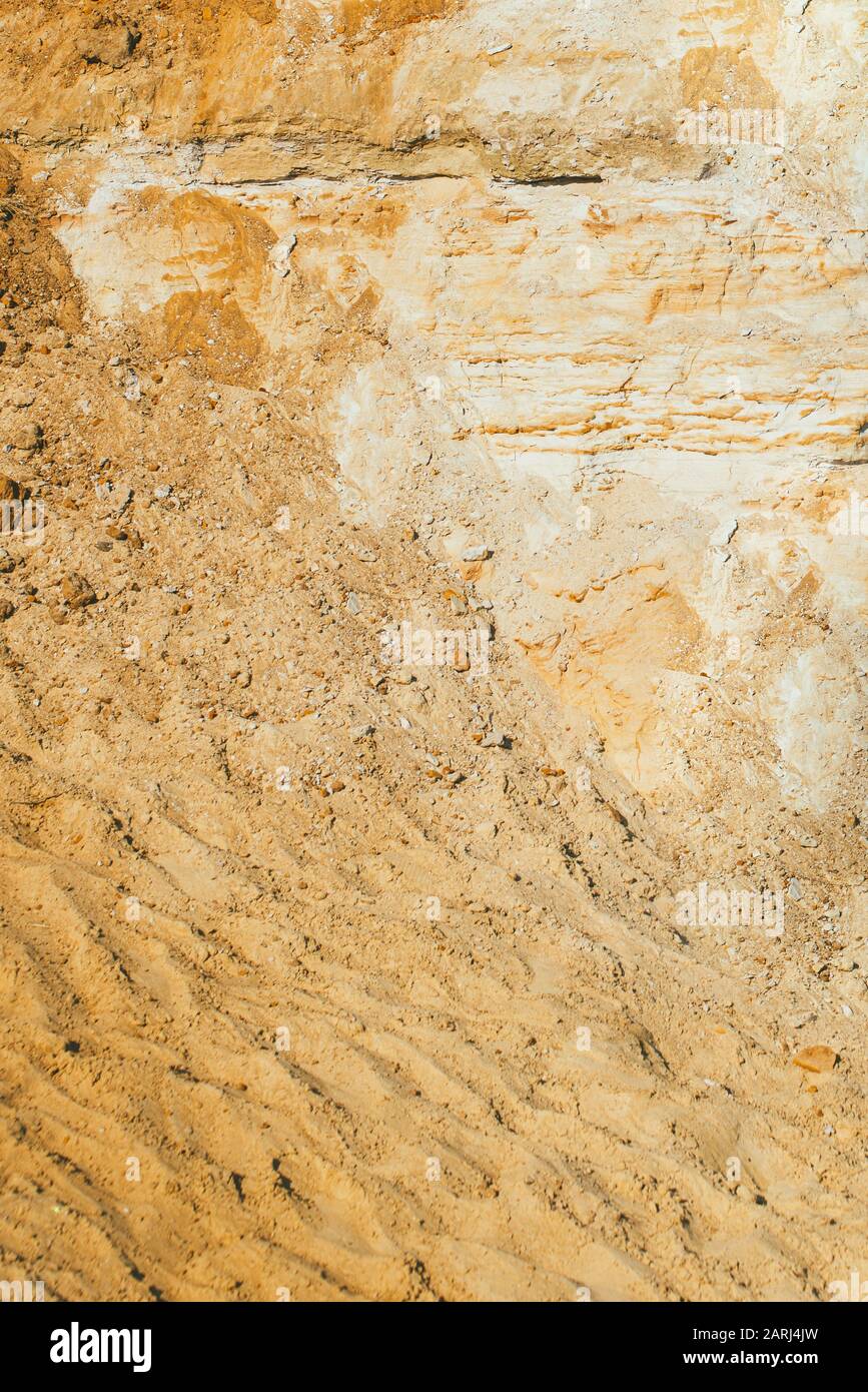 highly detailed texture of a sandy rock illuminated by the bright ...