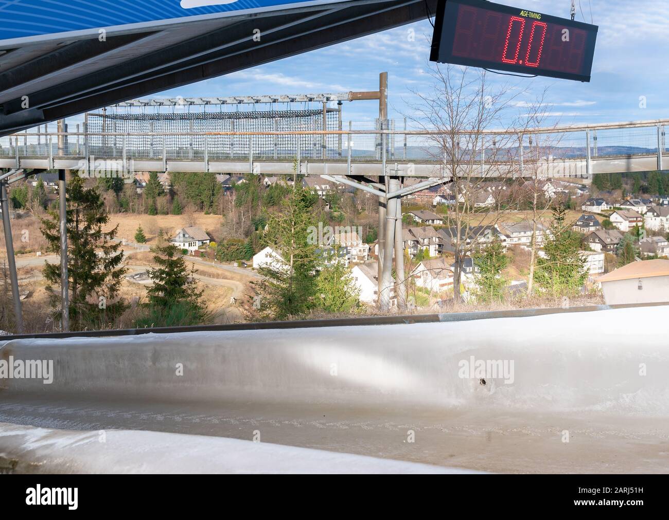 Bobsleigh ice channel in Winterberg. The digital clock measures the ...