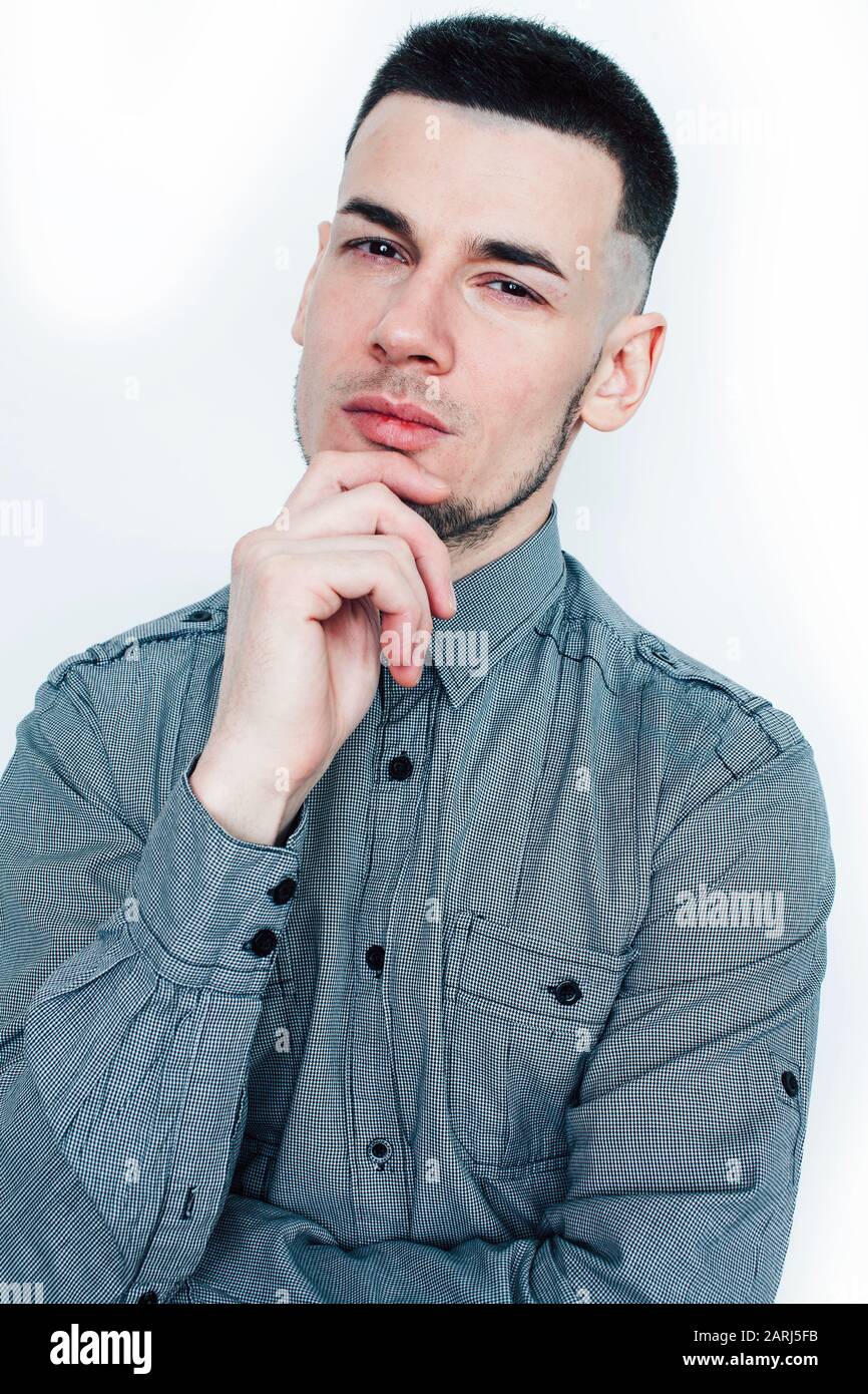 young handsome well groomed guy posing on white background gesturing ...