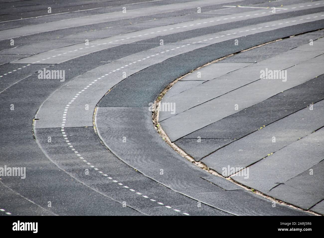 Gray running track in the stadium close up, background Stock Photo - Alamy