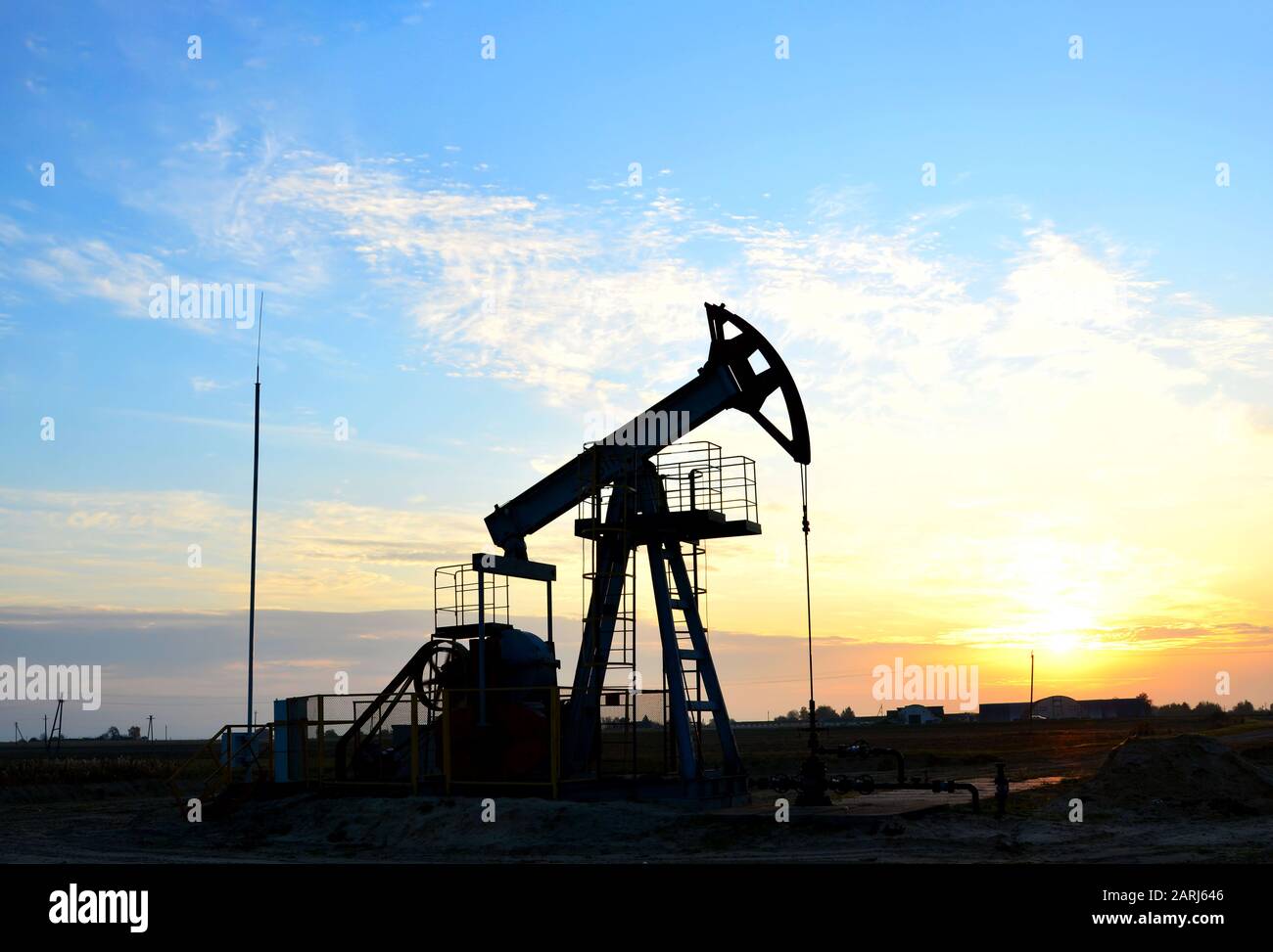 Oil drilling derricks at desert oilfield for fossil fuels output and ...