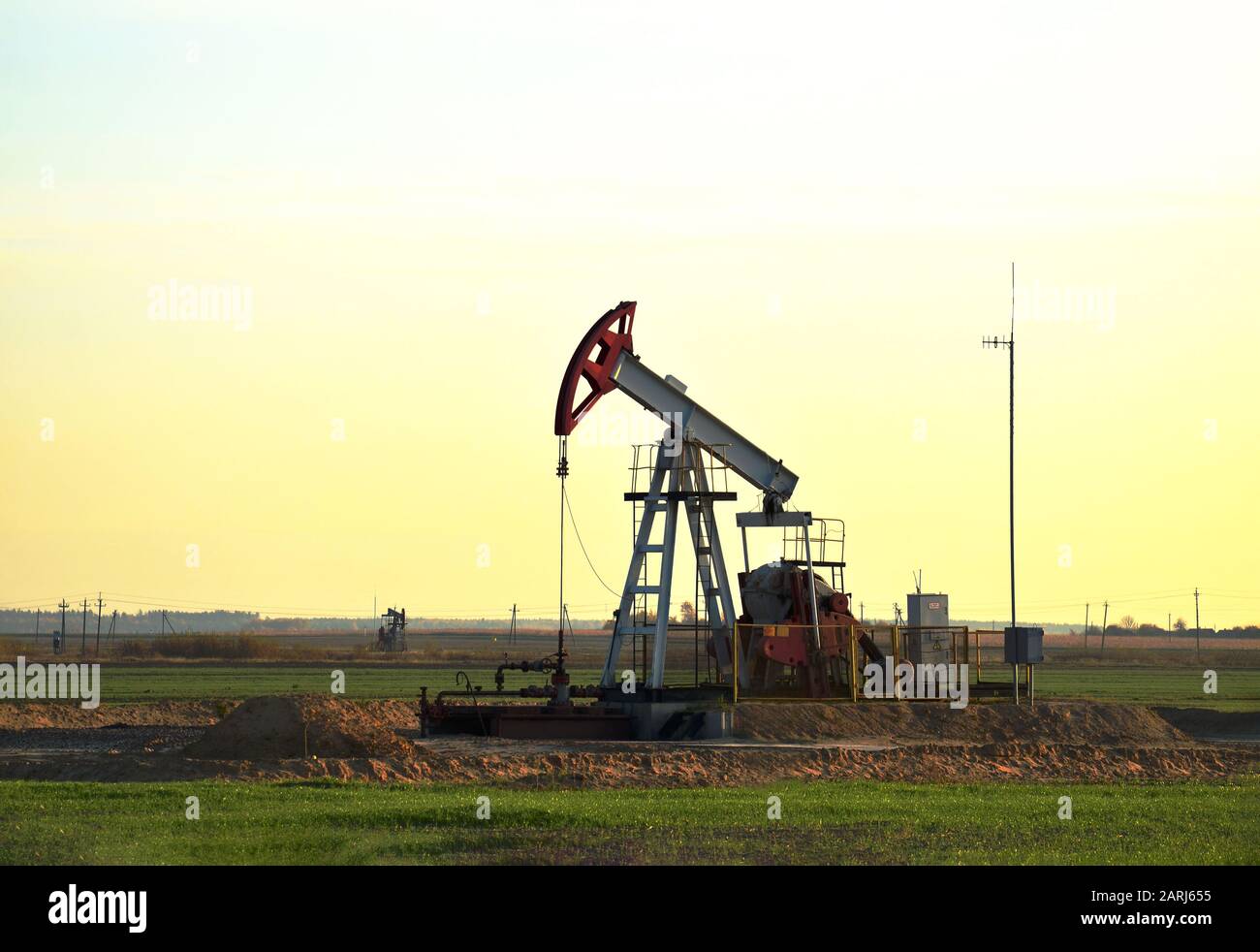 Oil drilling derricks at desert oilfield for fossil fuels output and ...
