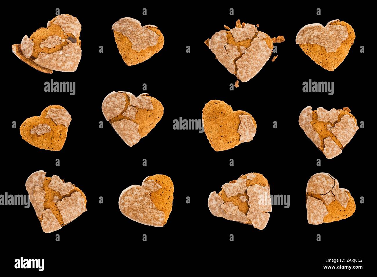 Stale, dry gingerbreads in shape of heart with cracked glaze with ...